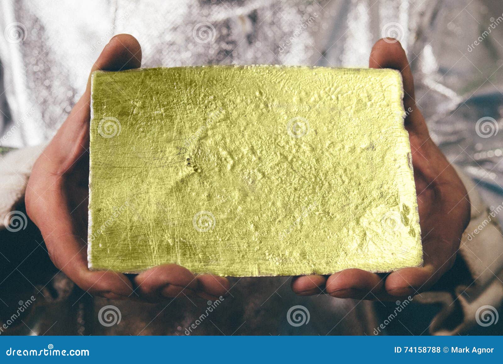 Gold ingot in hands stock photo. Image of metal, finance - 74158788