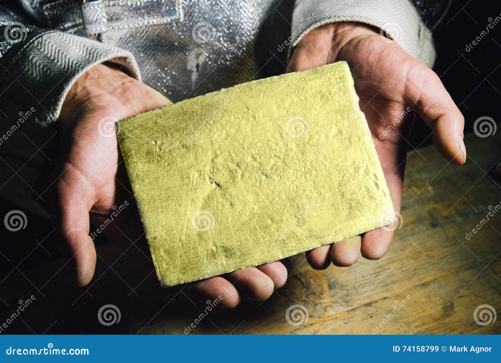 Gold ingot in hands stock image. Image of bank, invest - 74158799