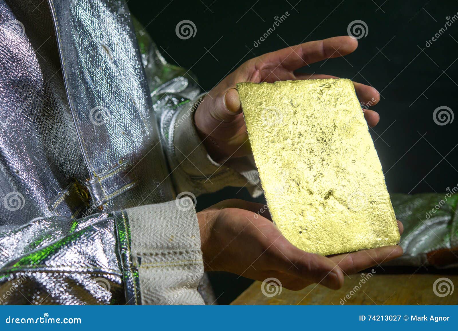 Gold ingot in hands stock image. Image of piece, investment - 74213027