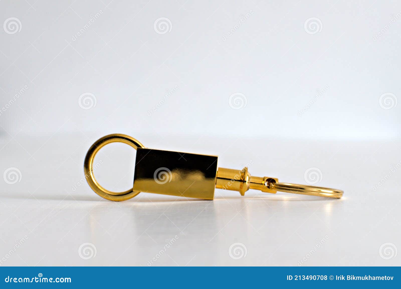 Gold keychain without keys stock photo. Image of blurred - 213490708
