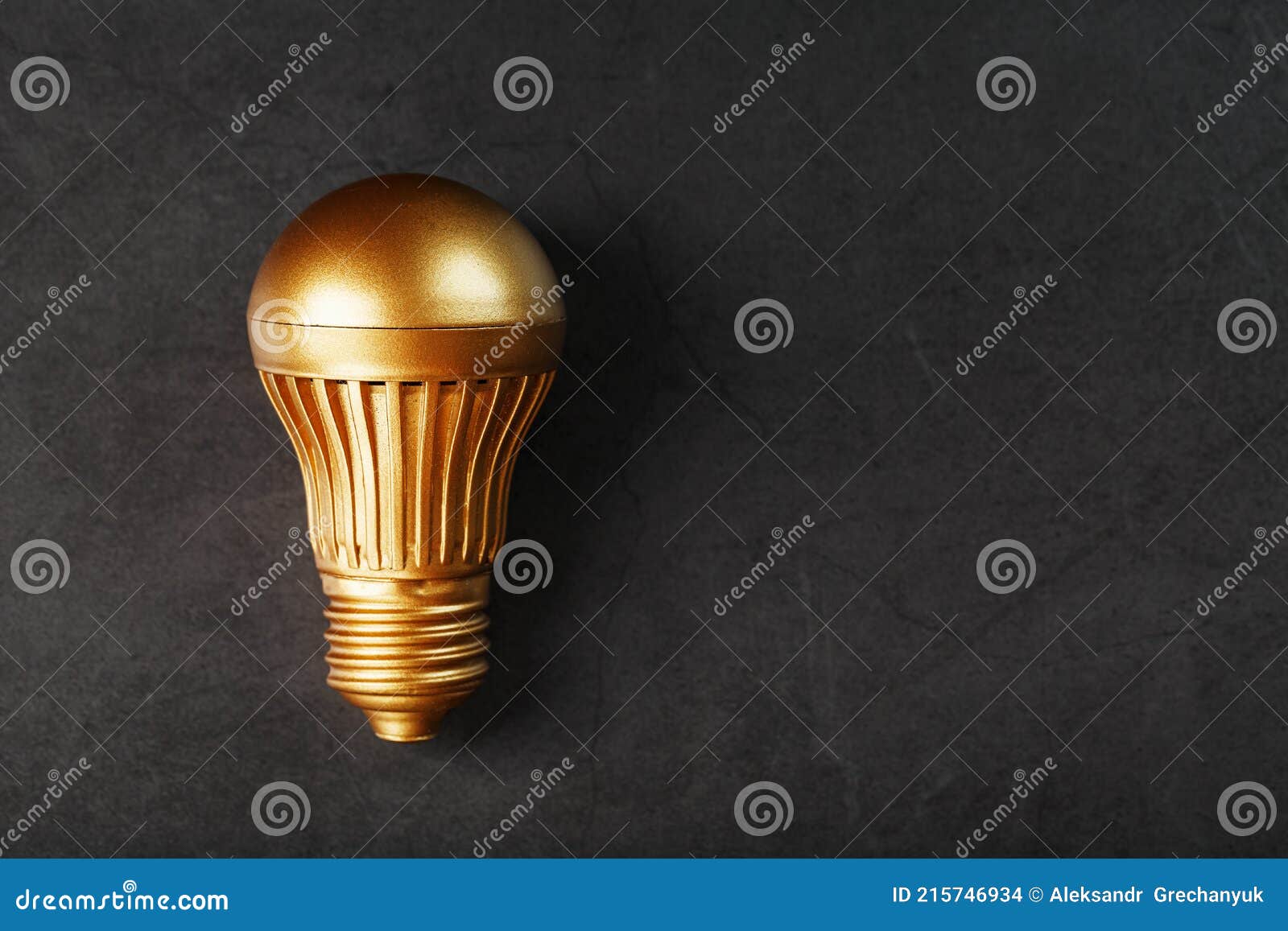 Gold Light Bulb on a Black Textured Background. Stock Photo - Image of ...