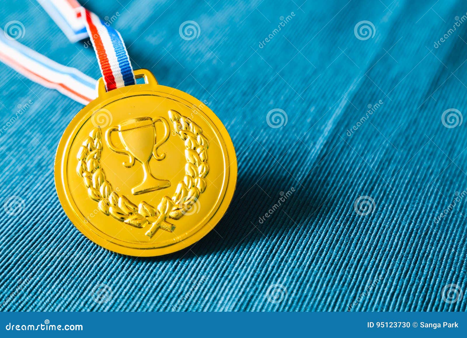 Gold Medal on Blue Background Stock Photo - Image of ceremony, goal ...
