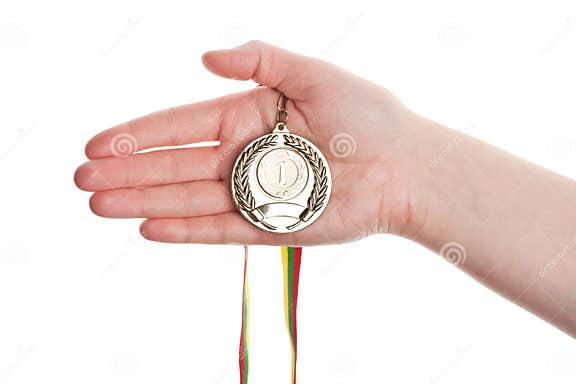 Gold medal in hand stock image. Image of placement, badge - 25546731
