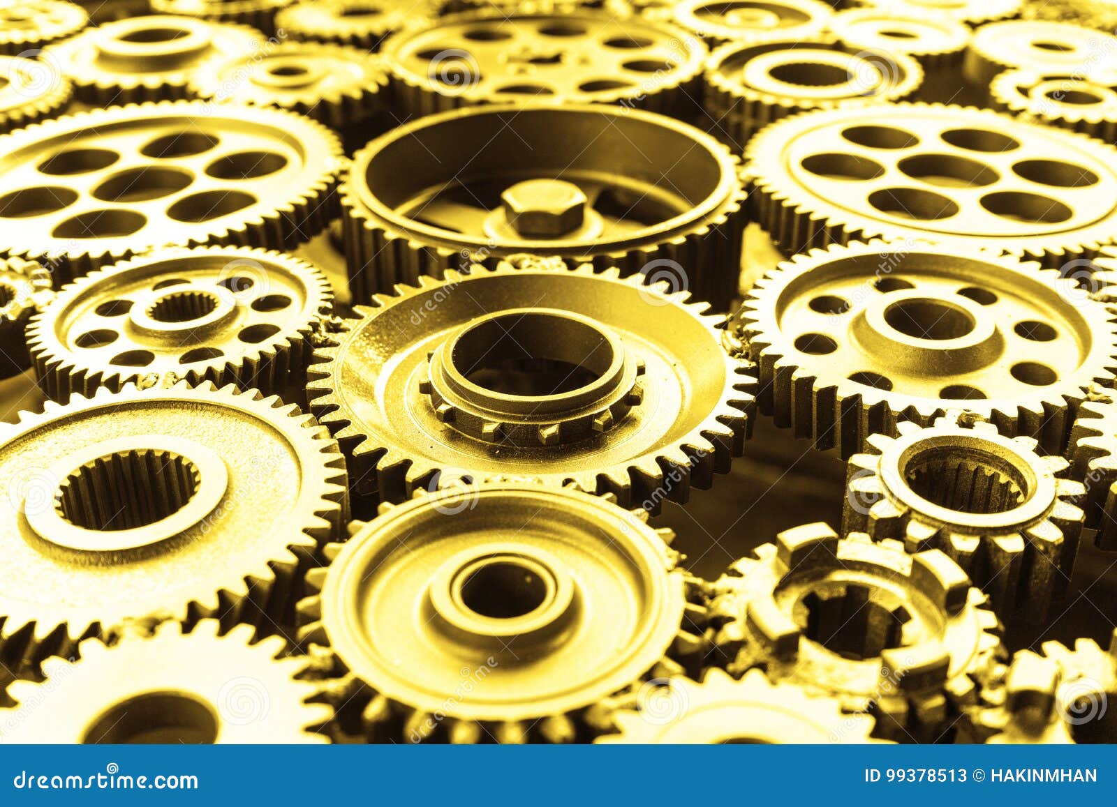 Gold metal cog wheels. stock image. Image of equipment - 99378513