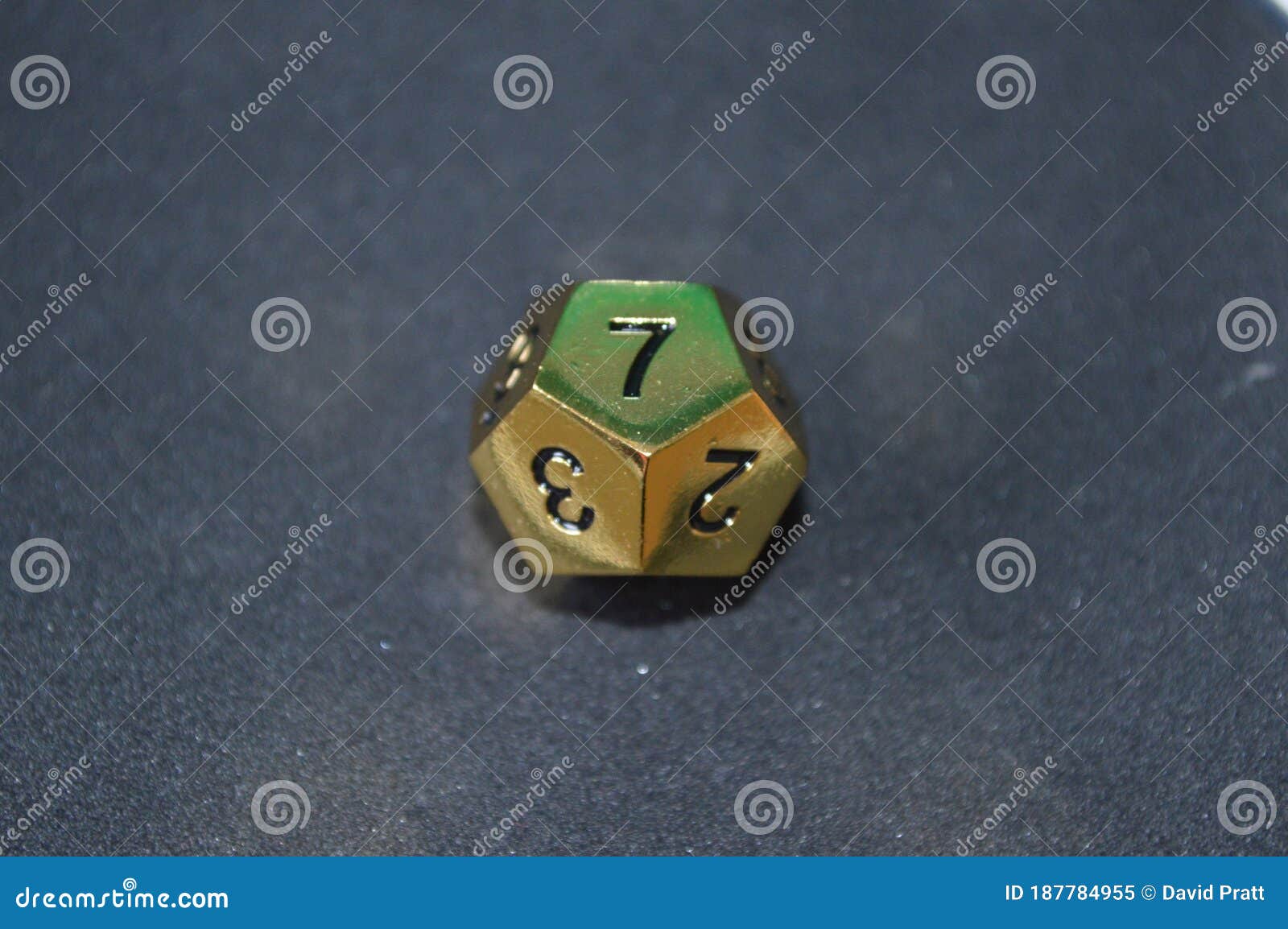 Gold Metallic D12 Twelve Sided Dice on Foam Surface Stock Image - Image ...
