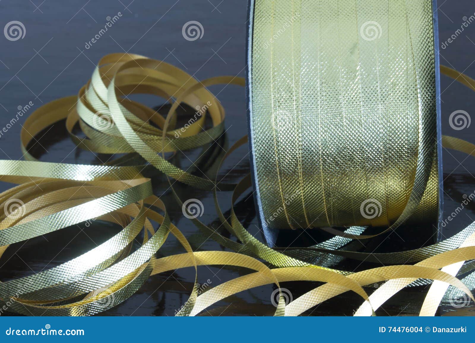 Gold metallic Ribbons stock photo. Image of colorful - 74476004