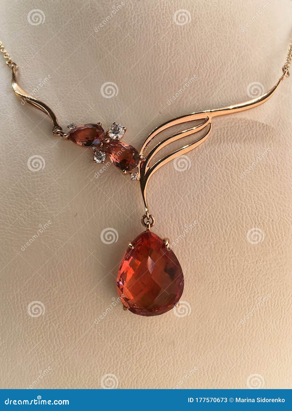 Gold Necklace with Sultanite on a Light Background. Stock Image - Image ...