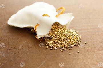 Gold nuggets spilling out stock image. Image of chip - 22896765
