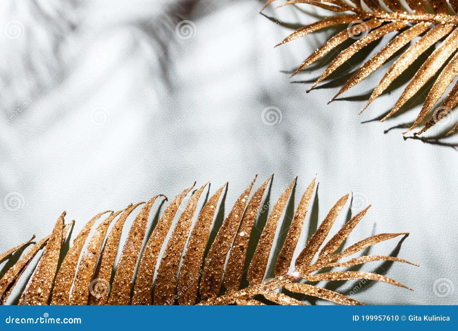 Gold Palm Leaves and Shadows on a Blue Wall Background Stock Photo ... Gold Palm Leaves and Shadows on a Blue Wall Background Stock Photo ...