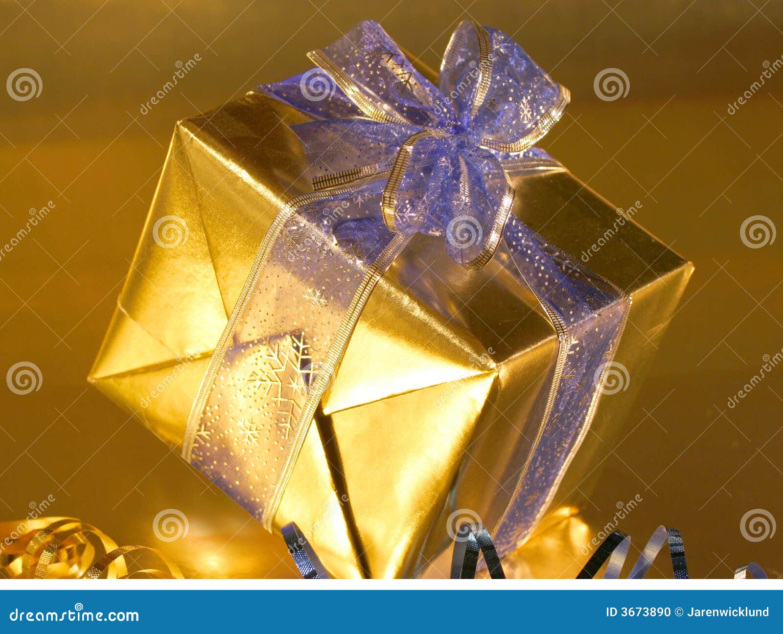 Gold Present with Blue Ribbons Stock Photo - Image of ribbon, gift: 3673890