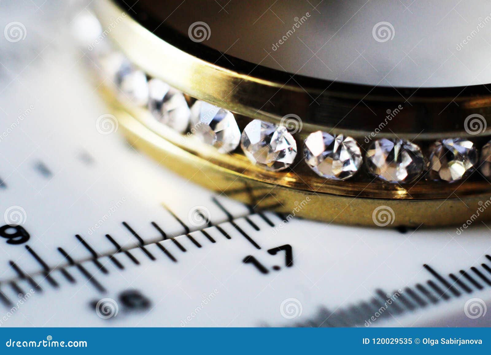 Gold Ring with Diamonds and a Measuring Instrument, the Value of ...
