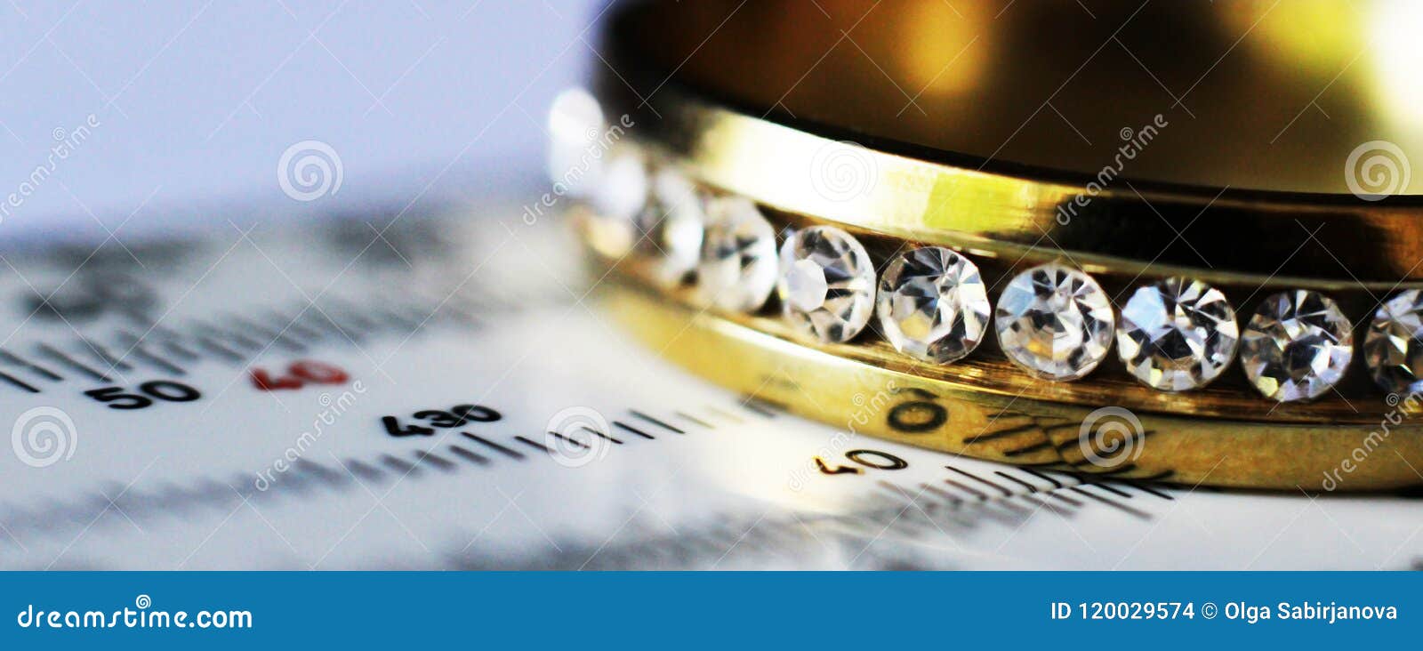 Gold Ring with Diamonds and a Measuring Instrument, the Value of ...