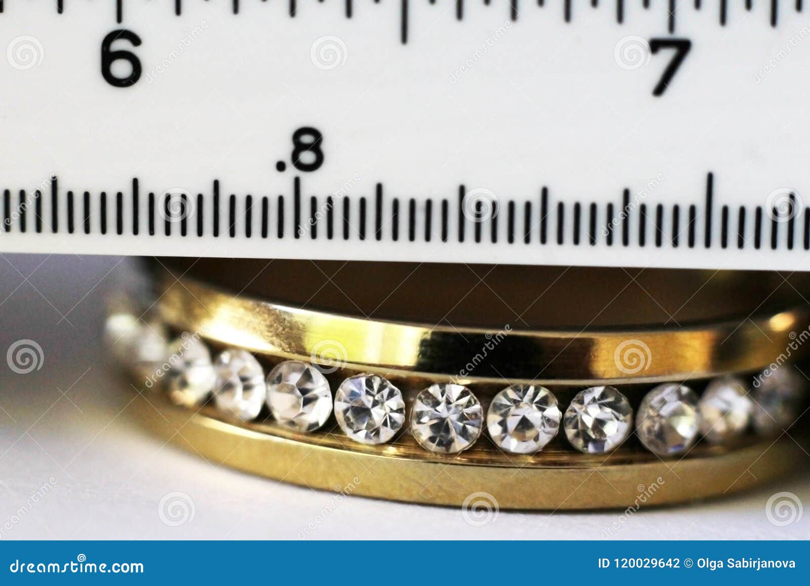 Gold Ring with Diamonds and a Measuring Instrument, the Value of ...