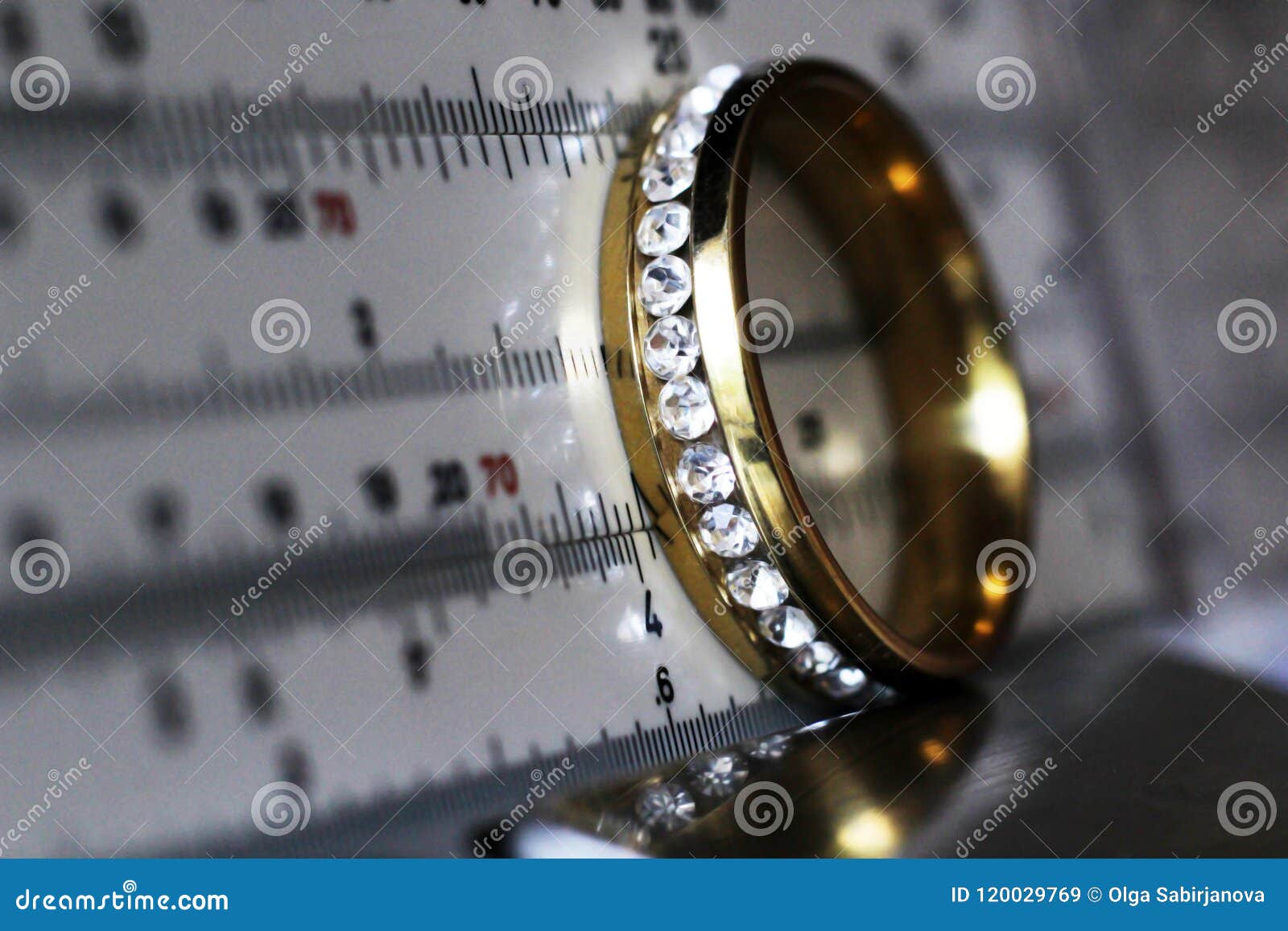 Gold Ring with Diamonds and a Measuring Instrument, the Value of ...