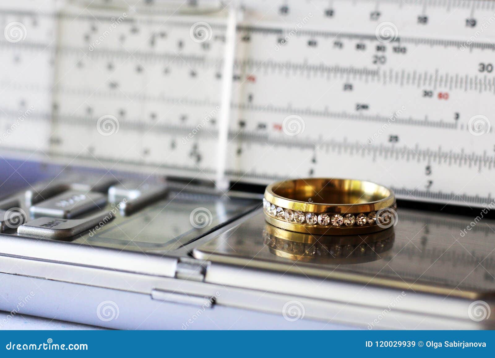 Gold Ring with Diamonds and a Measuring Instrument, the Value of ...