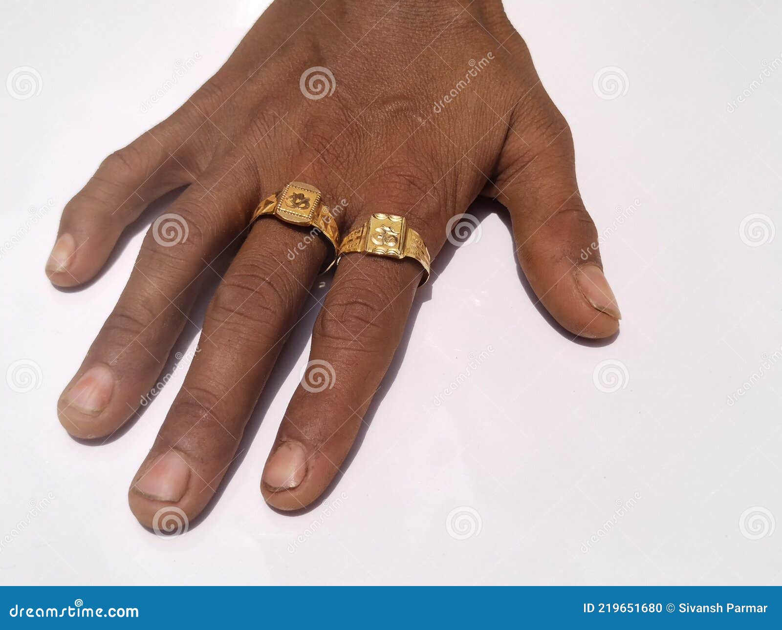 Gold ring and hand stock photo. Image of leather, textile - 219651680