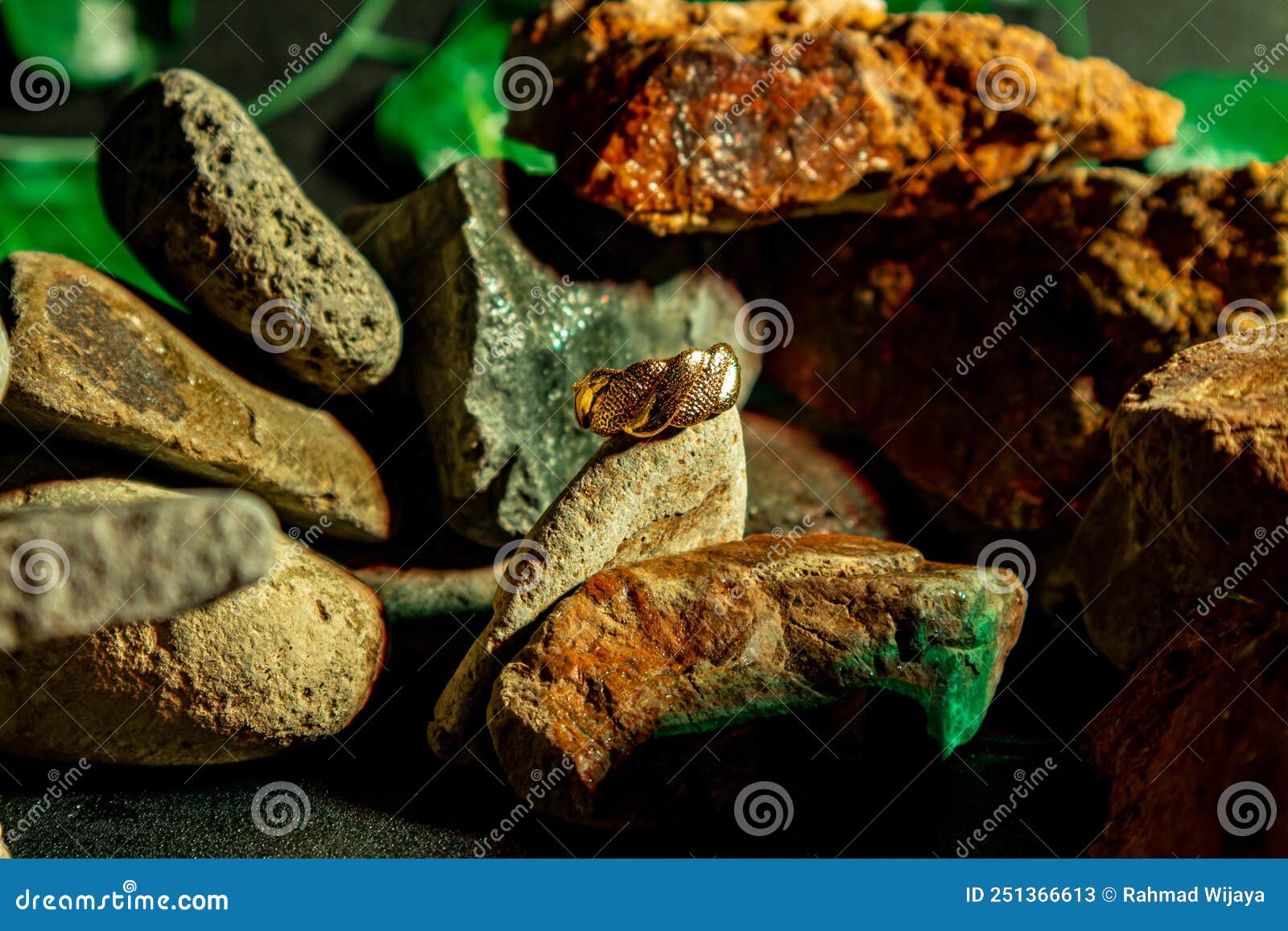 A Gold Ring with Rocks in the River Background Stock Image - Image of ...