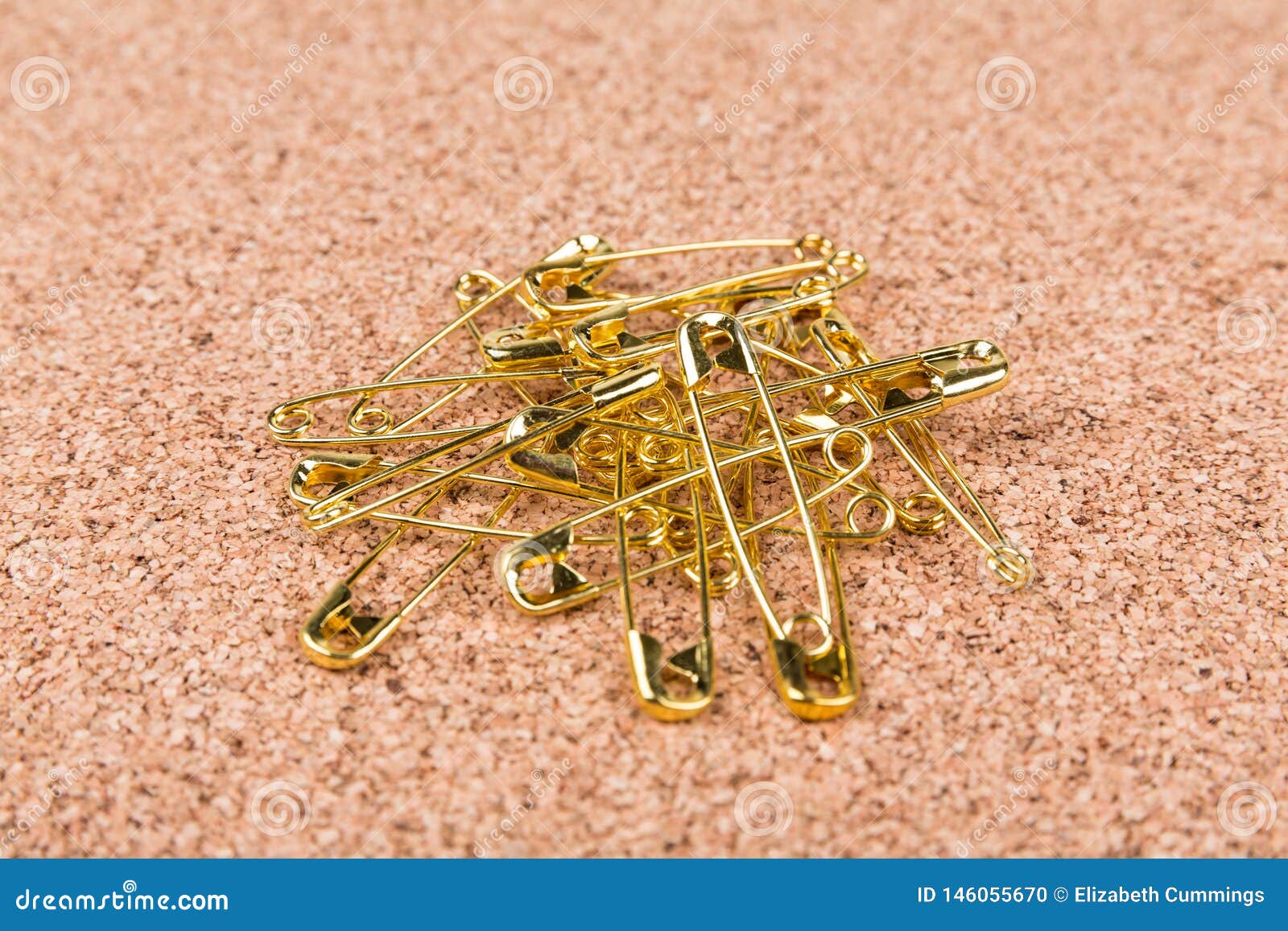 Stack of Gold Colored Safety Pins on Cork Stock Photo - Image of shiny ...