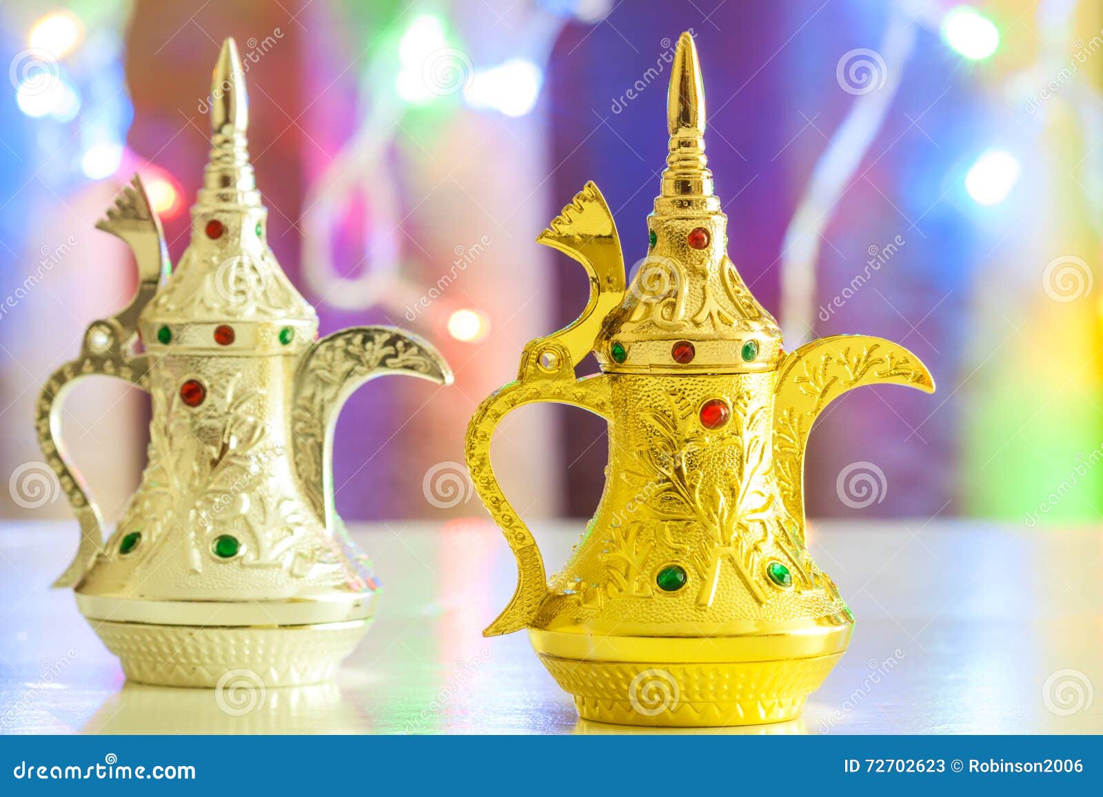 Gold and Silver Arabic Coffee Pots in Colorful Illuminated Background ...