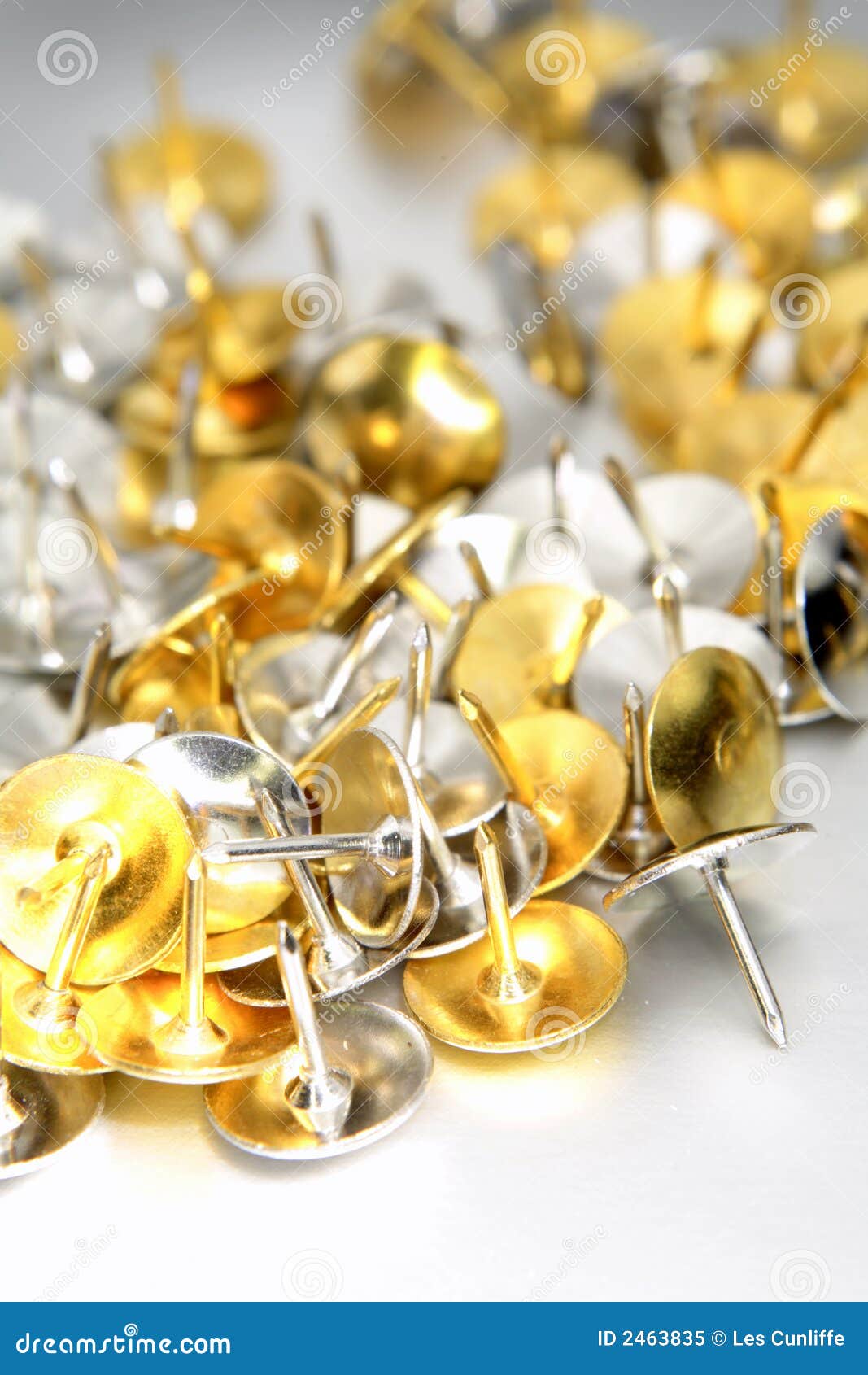 Gold and silver thumbtacks stock image. Image of pins - 2463835