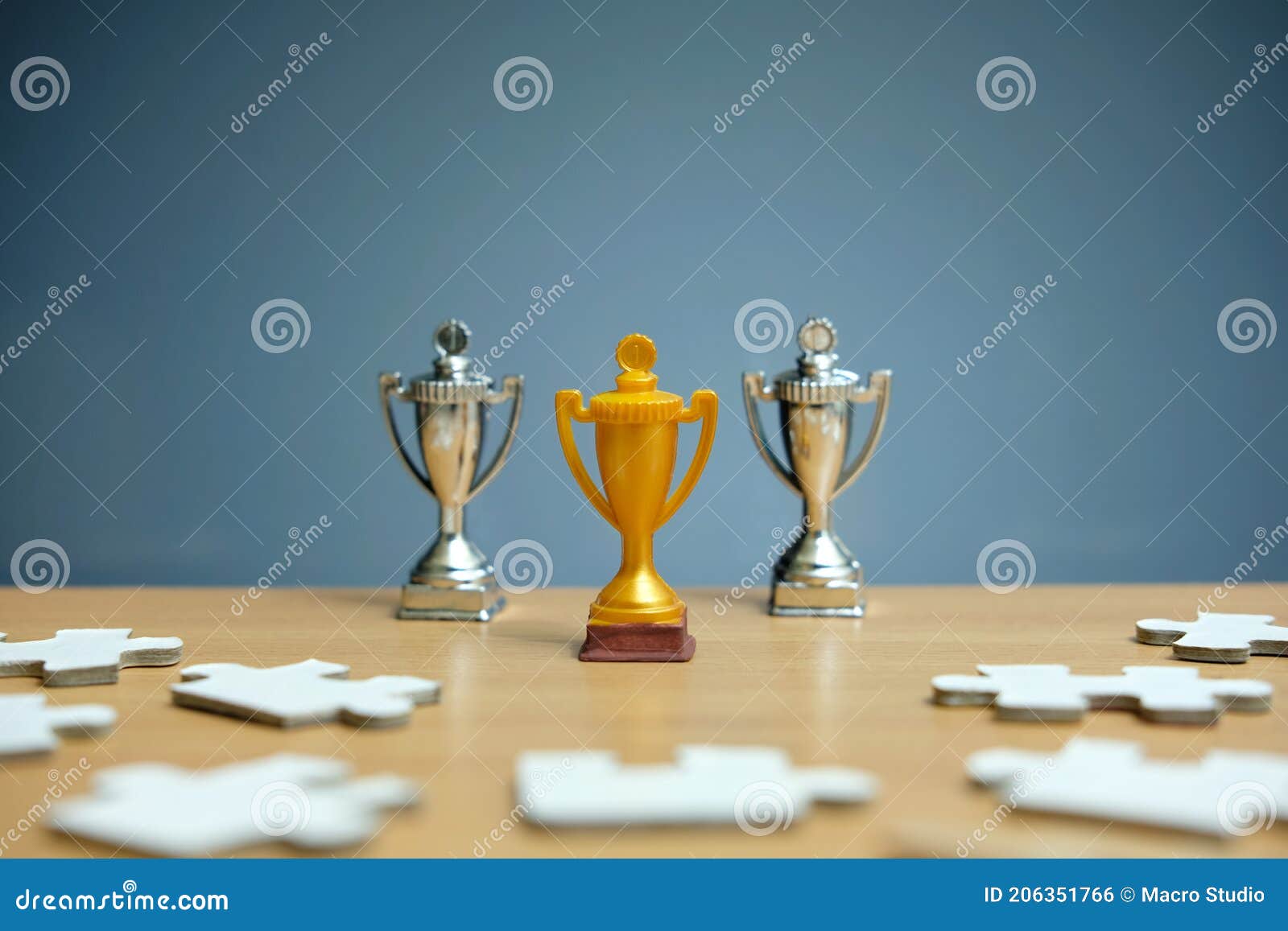 Gold and Silver Trophy Stands between Infront of Jigsaw Puzzles Stock ...