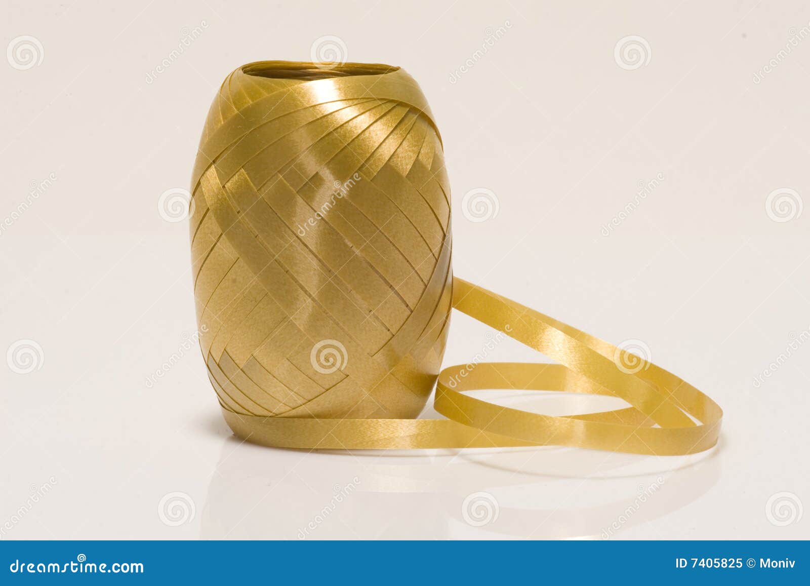 A gold spool of ribbon stock image. Image of giftwrapping - 7405825