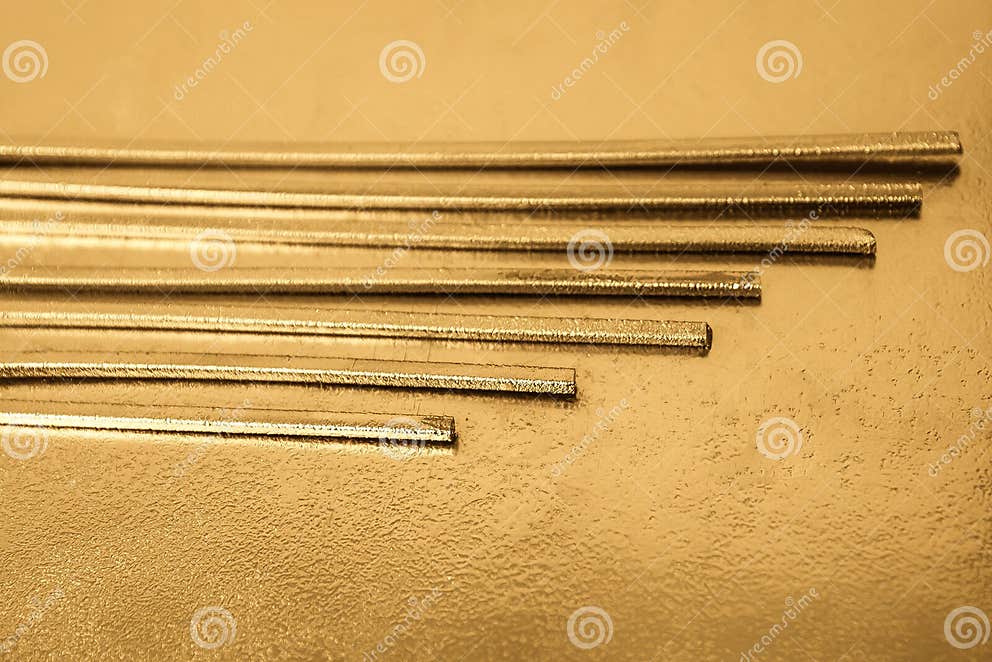 Gold Sticks on a Gold Background. Stock Image - Image of fineness ...