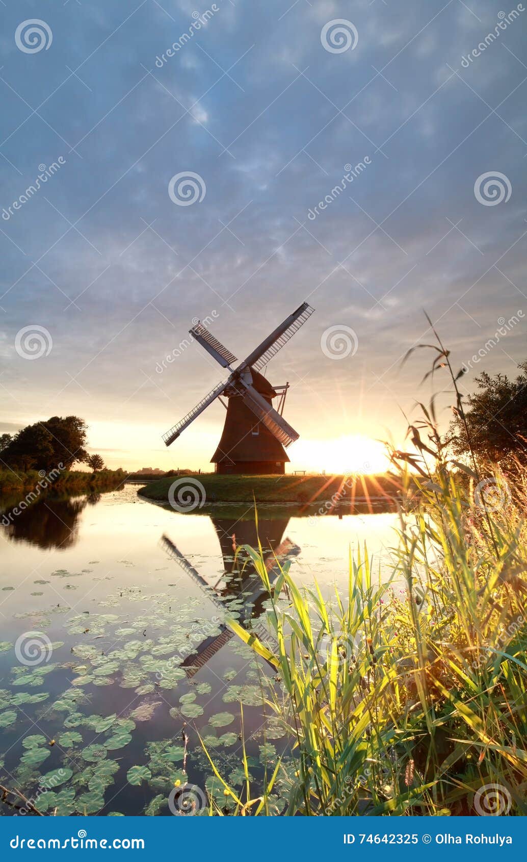 Gold Sunshine Behind Dutch Windmill by River Stock Image - Image of ...