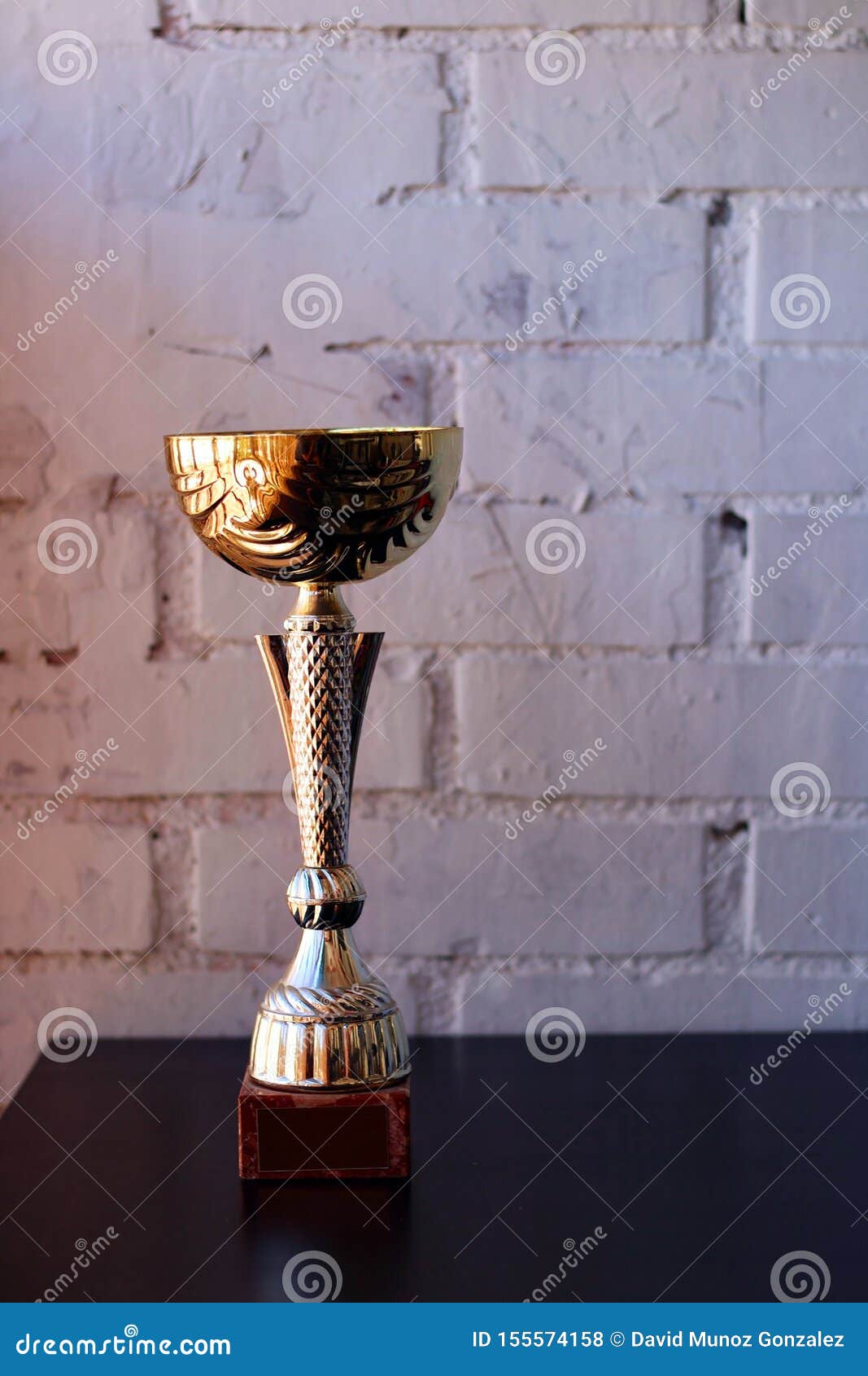 Gold Trophy on a White Wall Stock Photo - Image of celebration, trophy ...