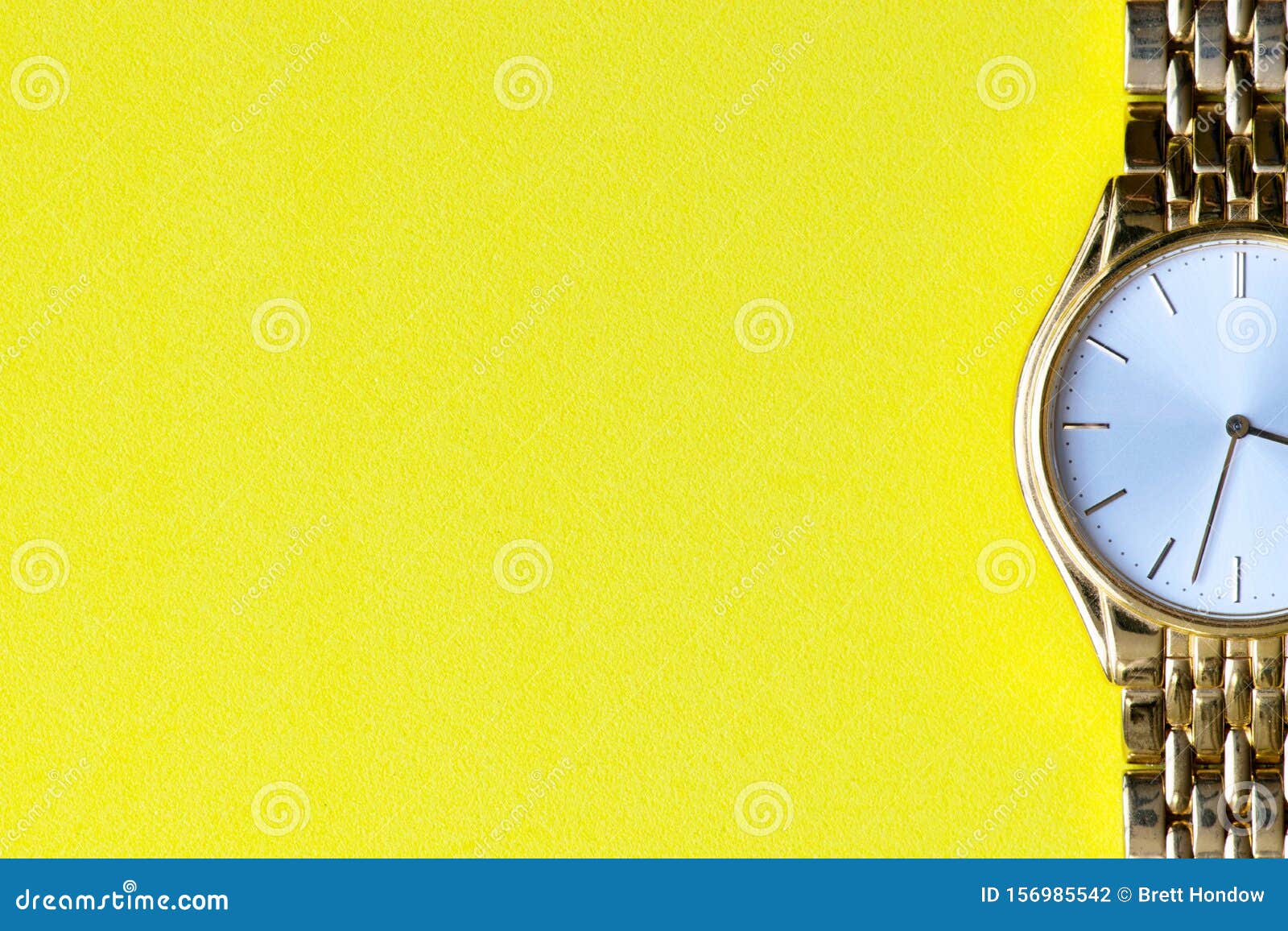 Gold Watch on a Plain Yellow Background. Stock Photo - Image of ...