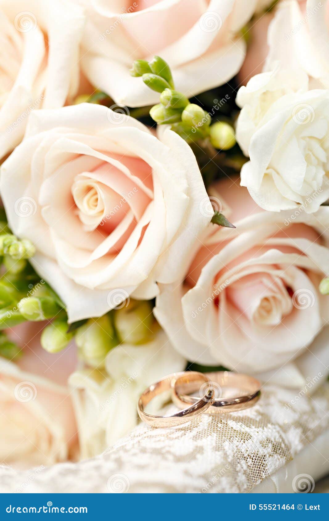 Gold Wedding Rings on Bouquet of Flowers for the Bride Stock Photo ...