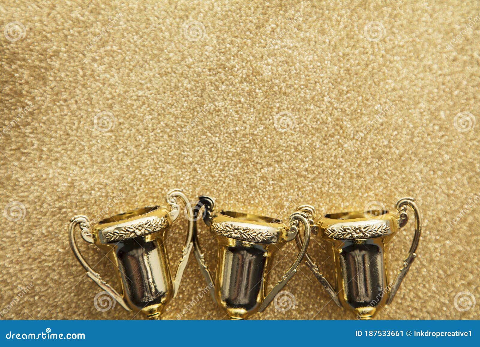 Gold Winners Achievement Trophy on a Gold Glitter Background Stock ...