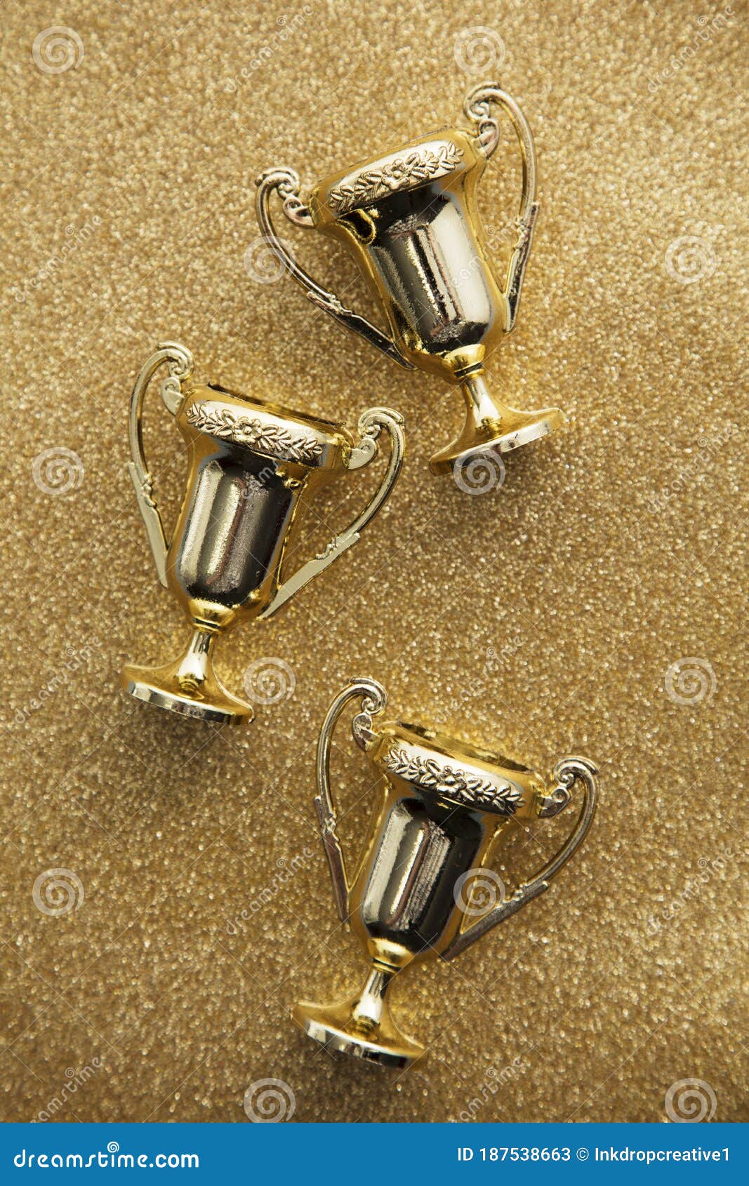Gold Winners Achievement Trophy on a Gold Glitter Background Stock ...
