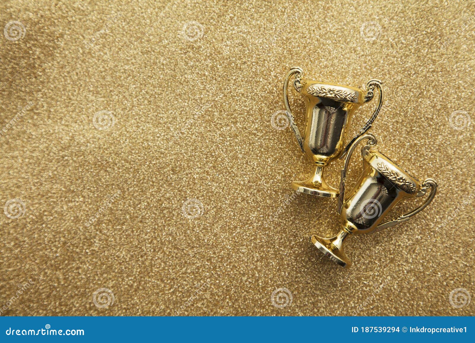 Gold Winners Achievement Trophy On A Gold Glitter Background Stock ...