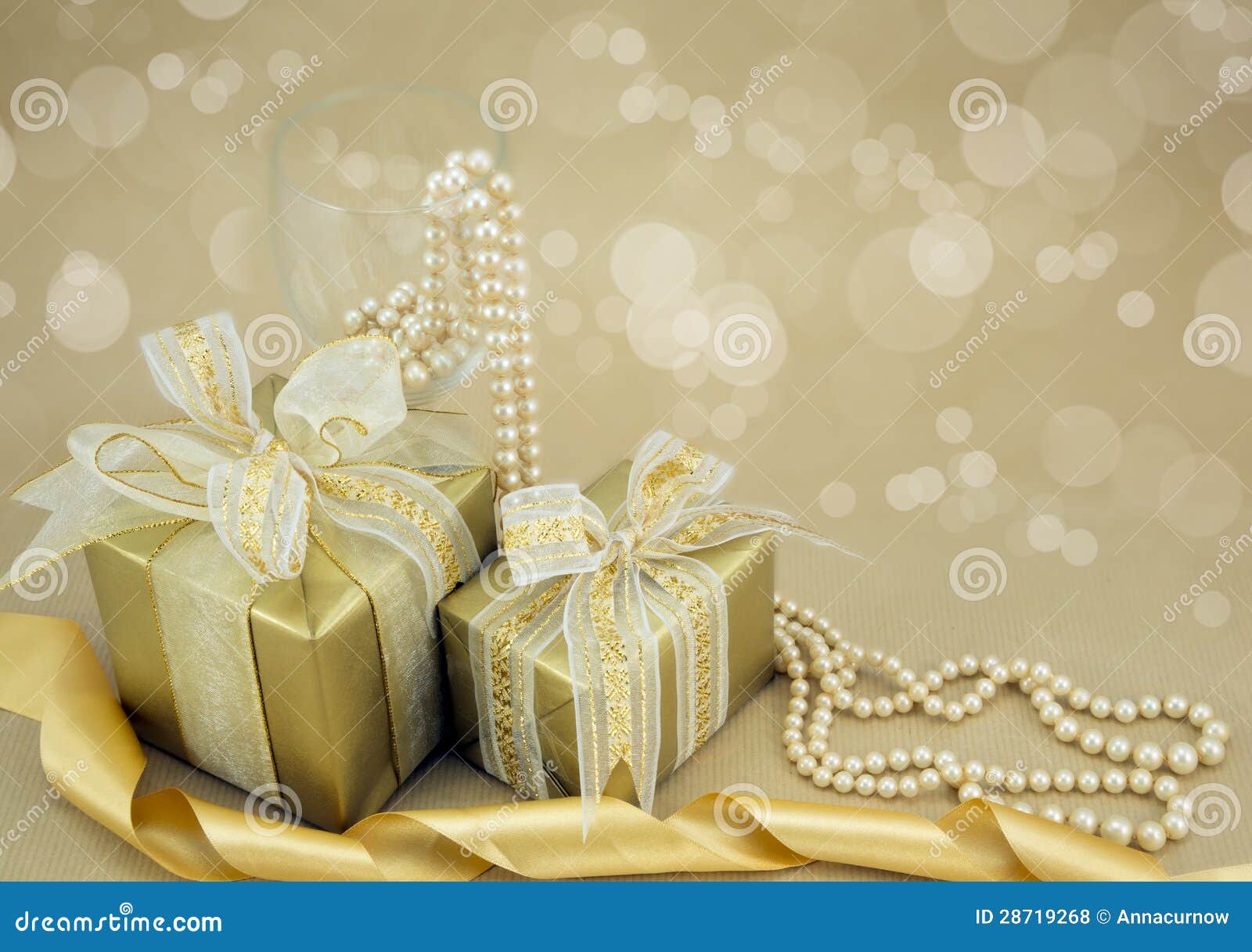 Gold Wrapped Presents with Pearls Stock Photo - Image of marriage, wine ...