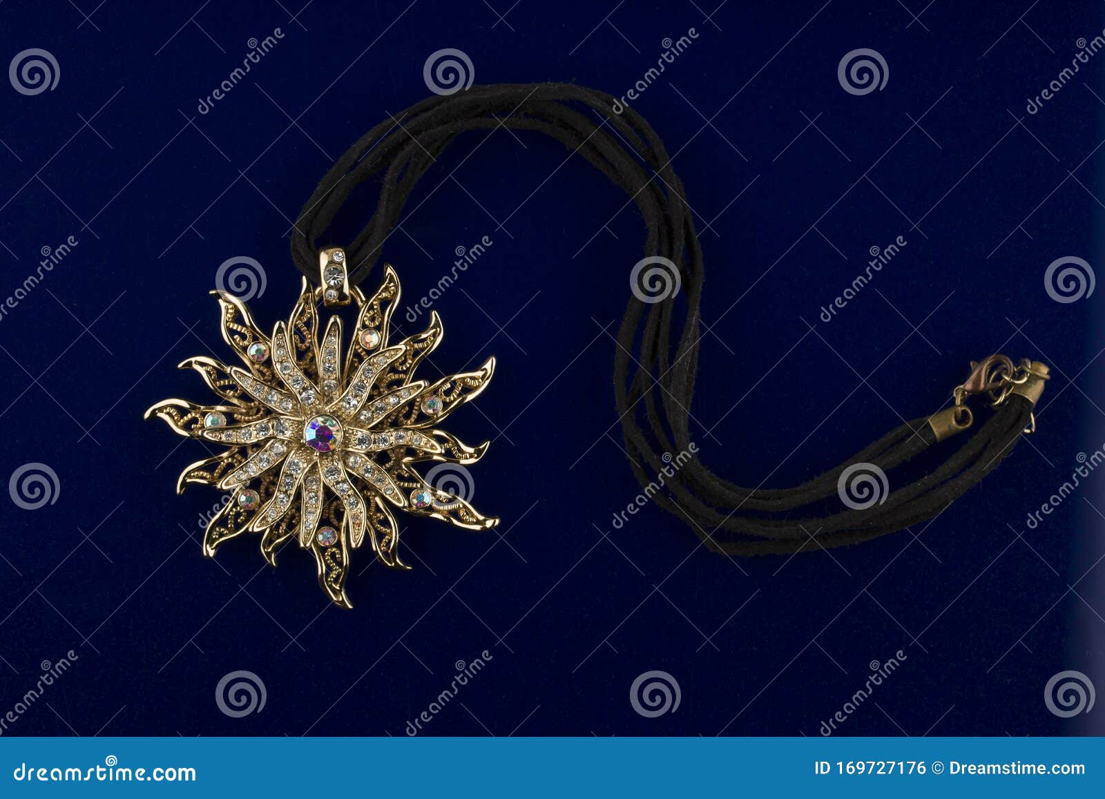 Golden Amulet of the Sun on a Blue Background Stock Photo - Image of ...