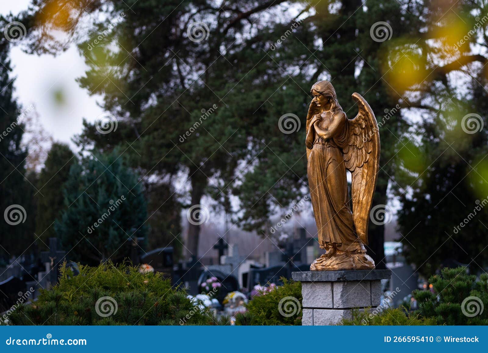 Golden Angel Sculpture in the Graveyard Stock Photo - Image of ...