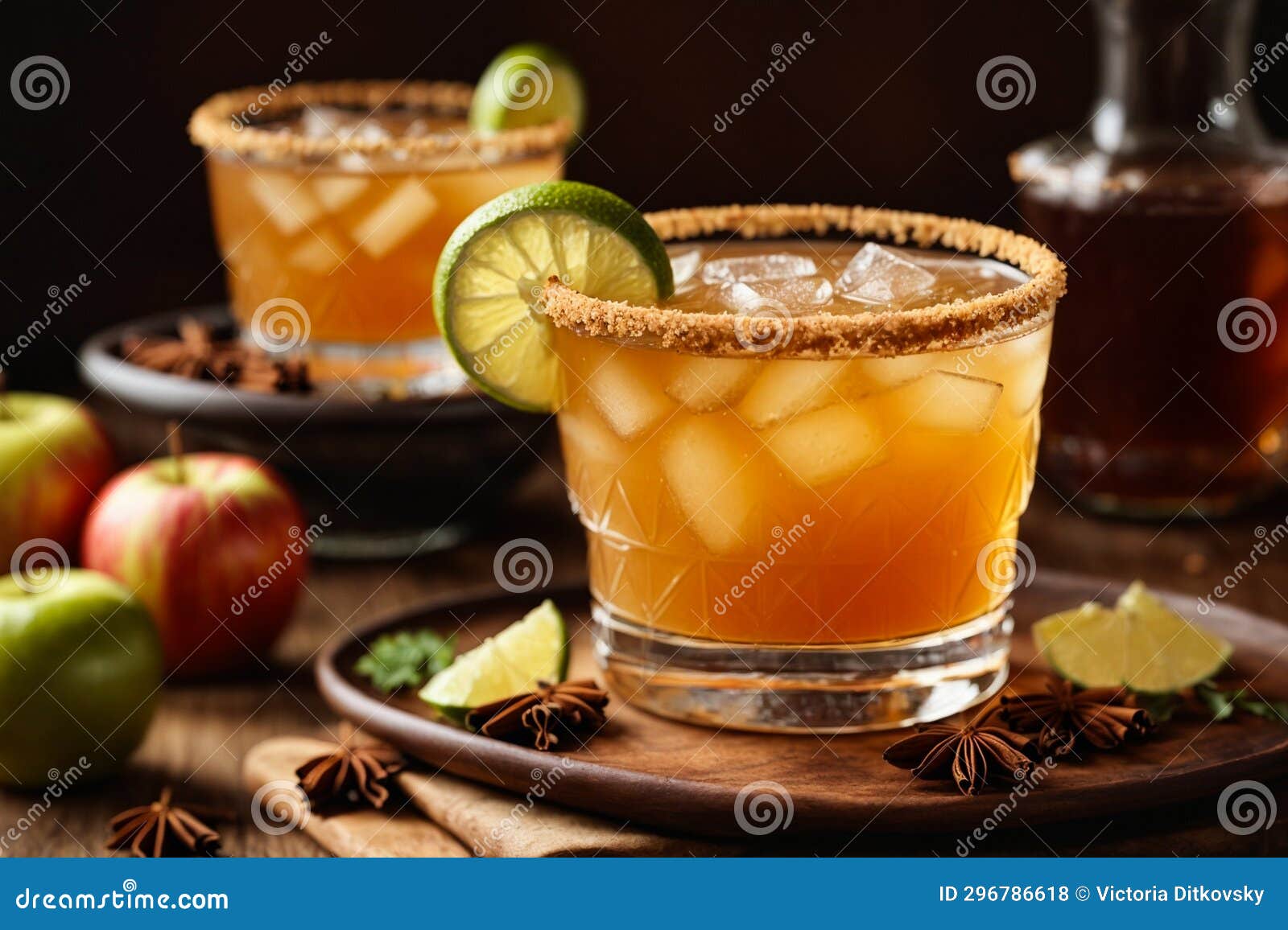 Golden Apple Cider on a Stand with Fall Spices and a Slice of Lime ...