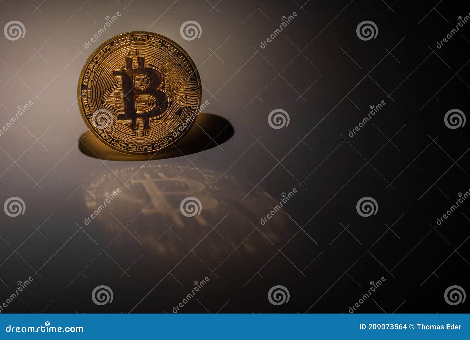 Golden Bitcoin Illuminated with Dark Shadow and Reflection Stock Photo ...