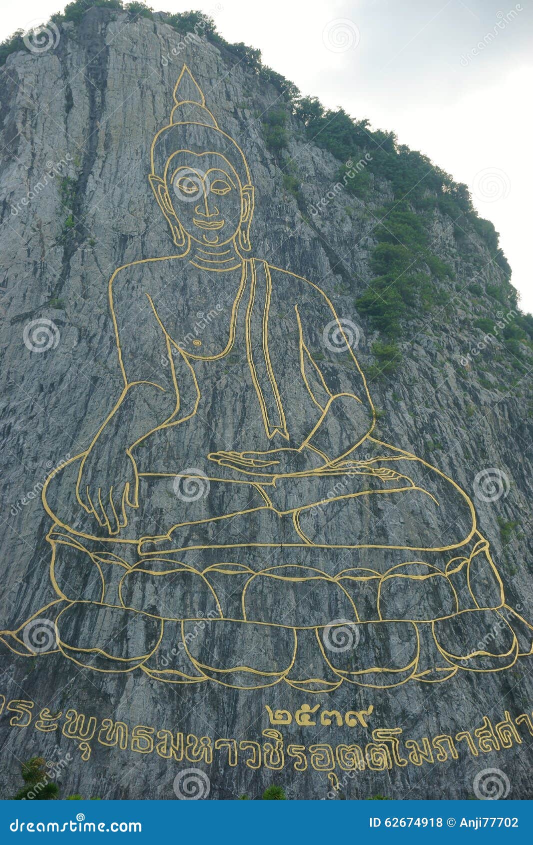 Golden Buddha on the rock stock photo. Image of monument - 62674918