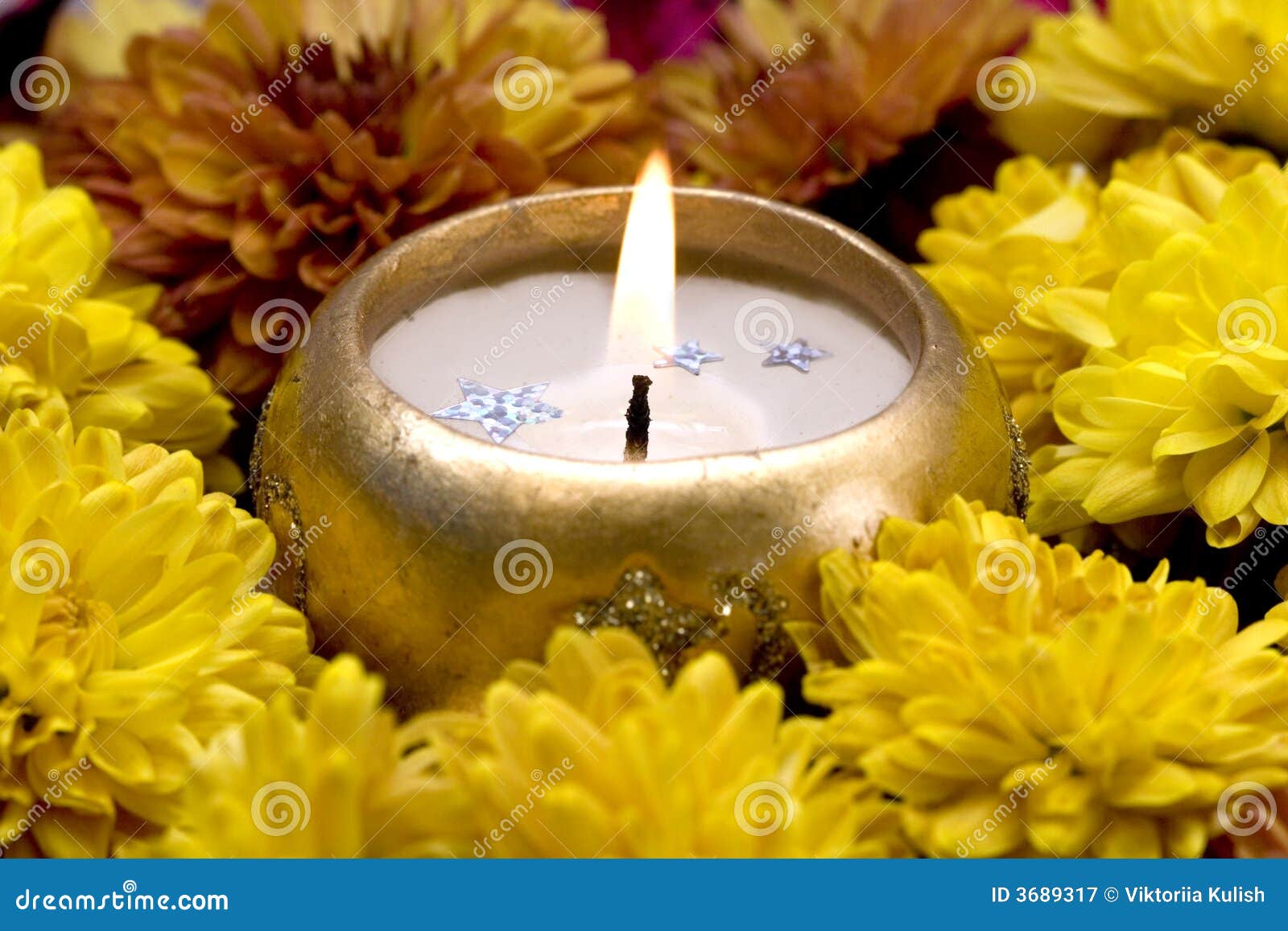 Golden candle with flowers stock image. Image of bodycare - 3689317