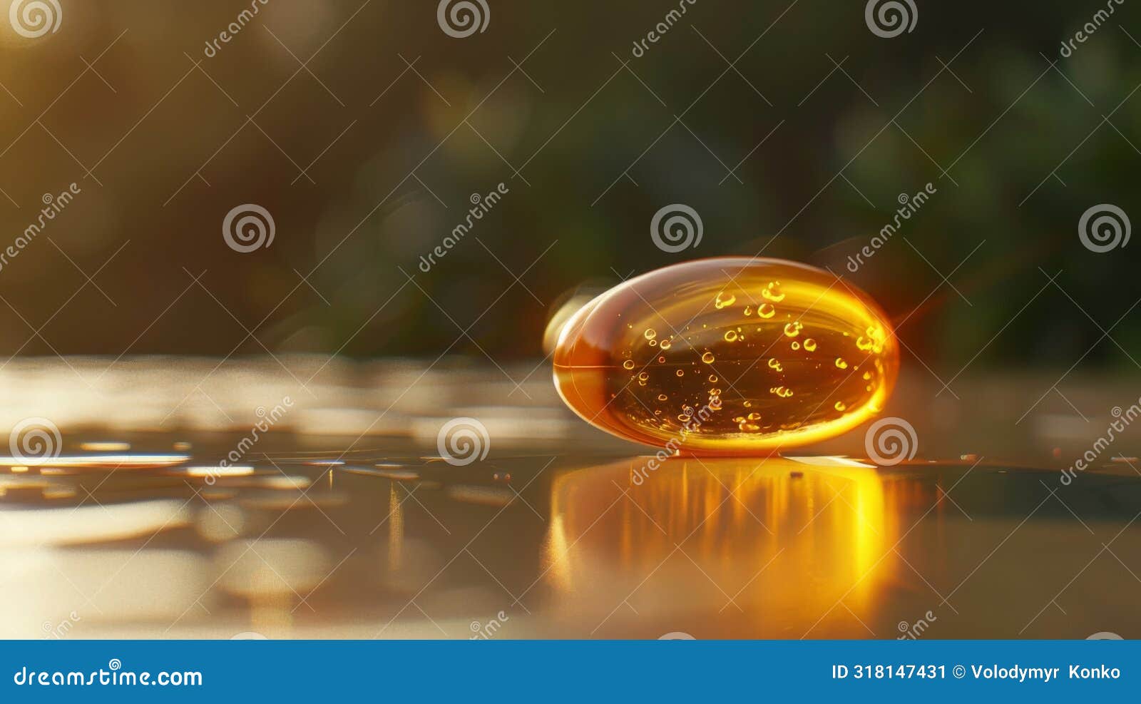 Golden Capsule with Bubbles on Reflective Surface Stock Image - Image ...