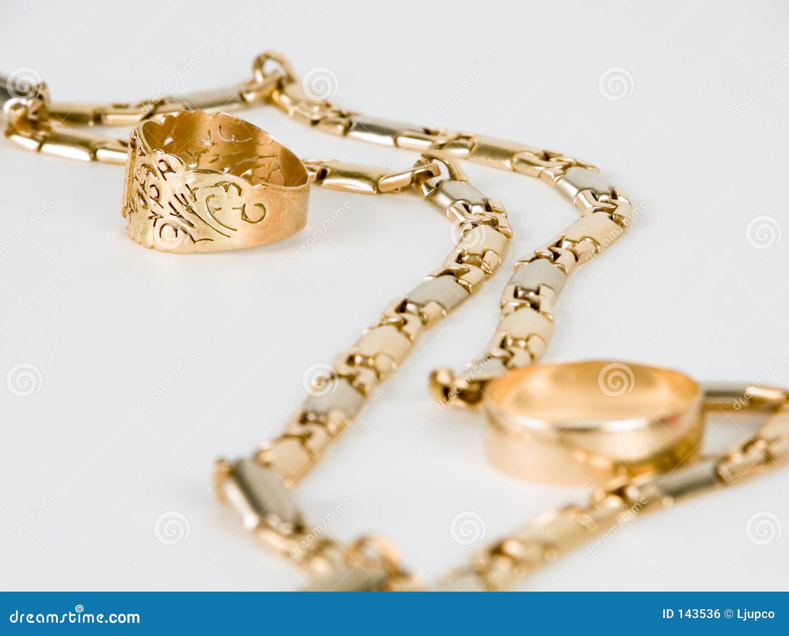 A Golden Chain and Two Rings Stock Photo - Image of gift, gold: 143536