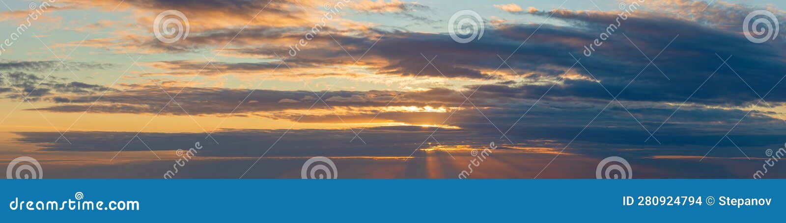 Golden Clouds after Sunset on a Dark Blue Sky Stock Photo - Image of ...