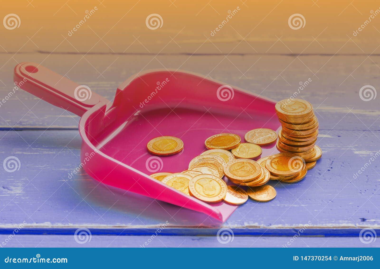 Golden Coin Stack or Money in Dust Pan Stock Photo - Image of finance ...