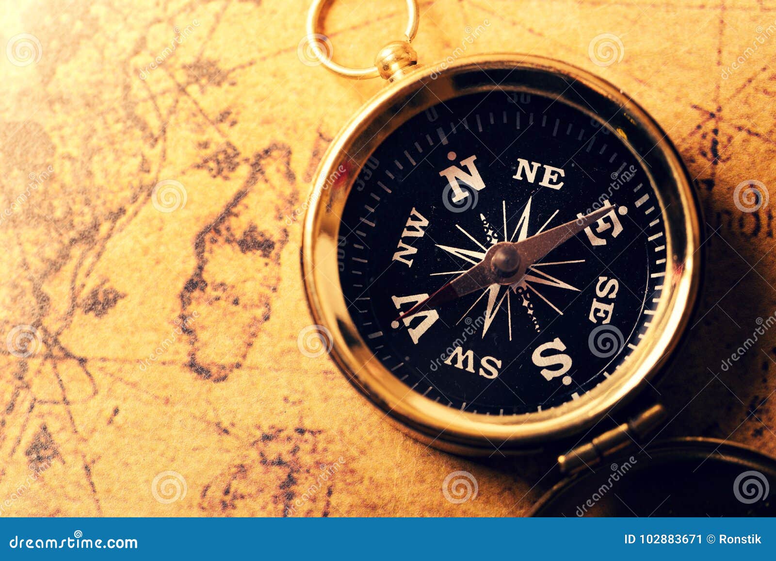 Golden Compass on Old Treasure Map Stock Image - Image of search, metal ...