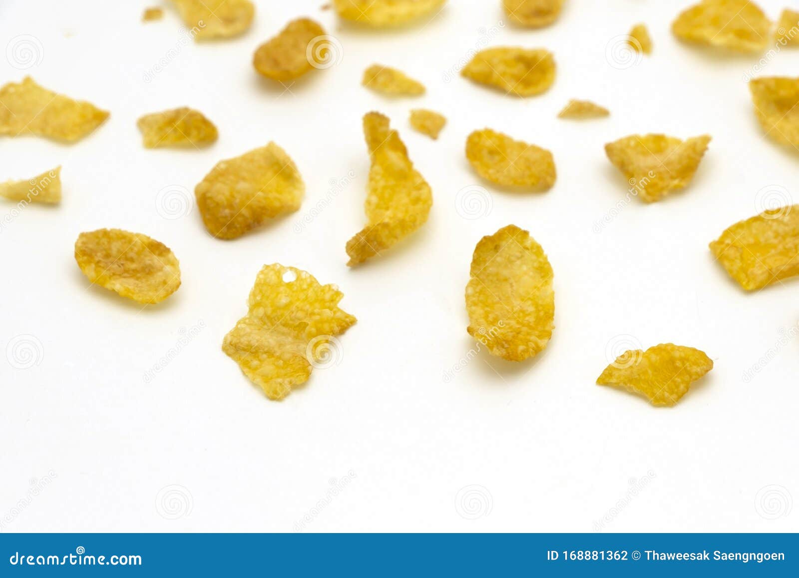 Golden Cornflakes Splash on White Background with Copy Space Text Stock ...