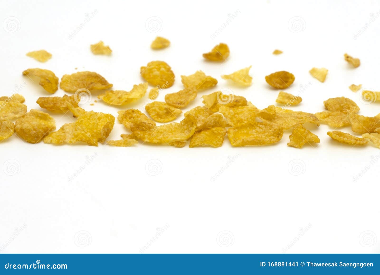 Golden Cornflakes Splash on White Background with Copy Space Text Stock ...