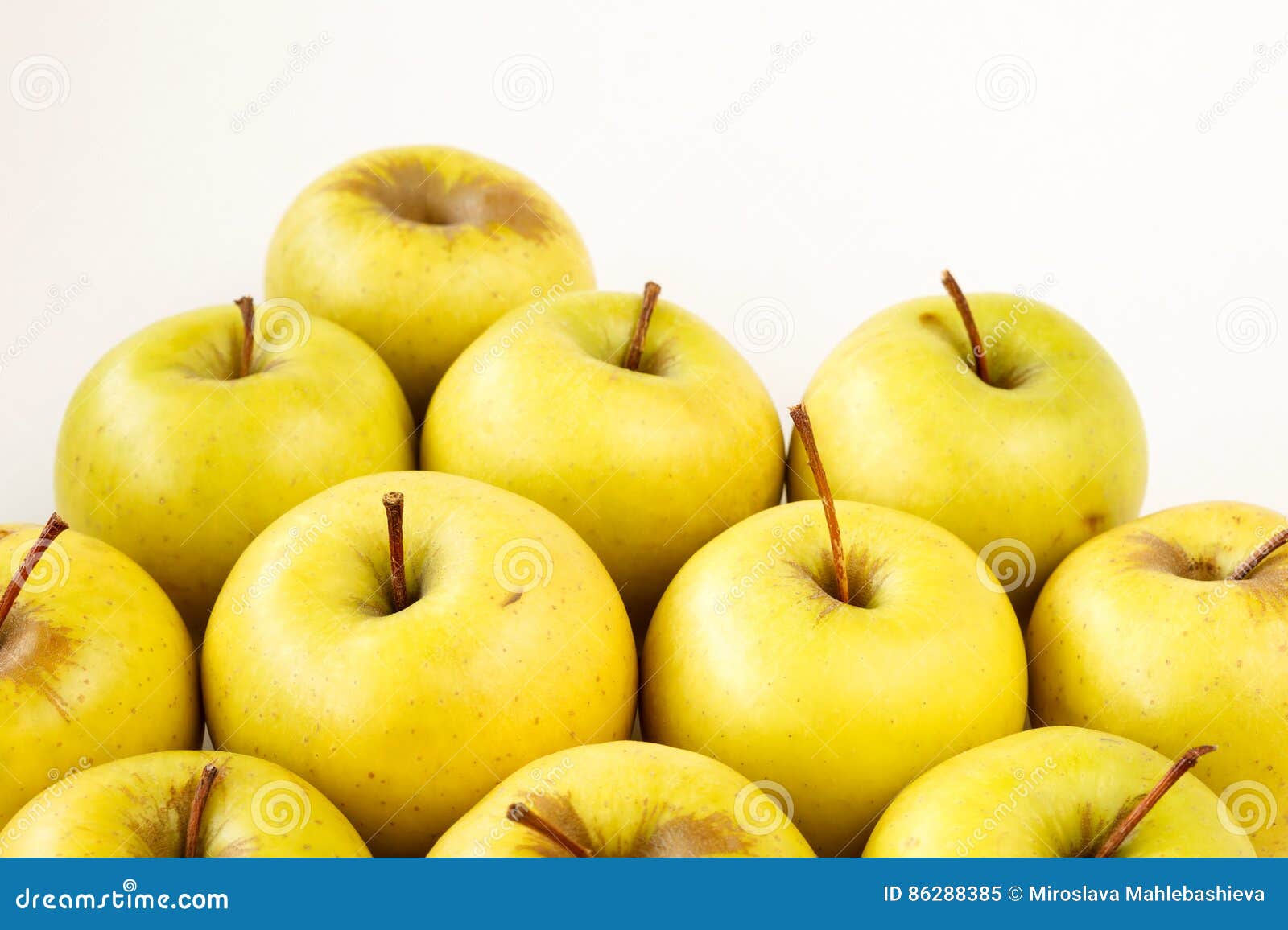 Golden Delicious Apples on Light Beige Background with Copy Space Stock ...