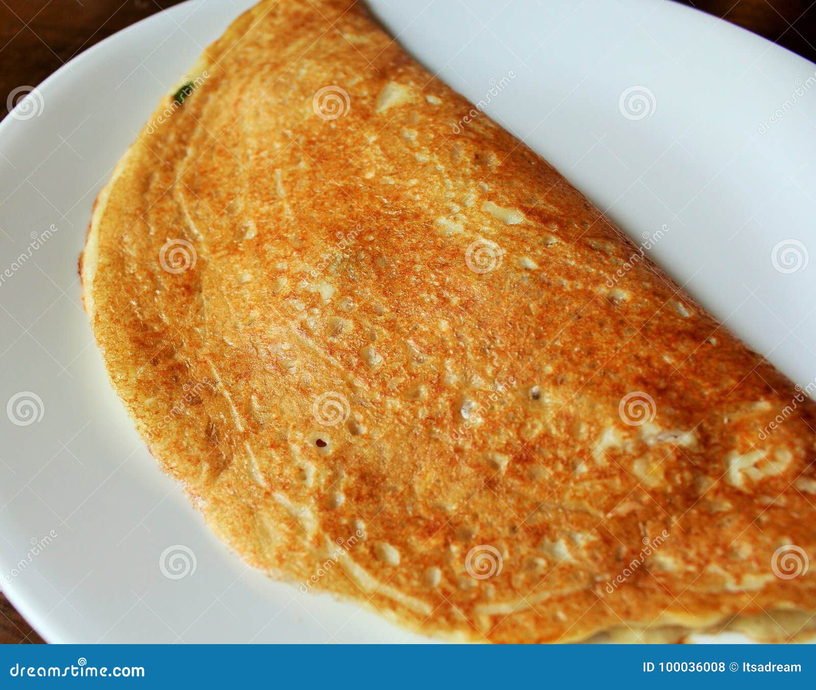 Golden dosa on white plate stock photo. Image of dosa - 100036008